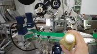 China Automatic Lubricant Bottle Cap Labeling Machine with Servo Positioning and Tamper-Evident Labeling System for sale