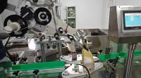China Automatic Lubricant Bottle Cap Labeling Machine with Servo Positioning and Tamper-Evident Labeling System for sale
