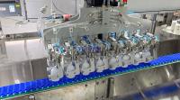 China Automatic Energy Drink Cap Placing Machine with Servo Cap Feeding and High-Speed Capping Automation System for sale
