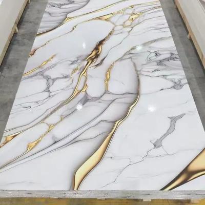 China Pvc Wpc Well Uv Wall Panel Marble Sheet Gold and White Large Effect PVC PANEL WALL Panels Pvc for sale
