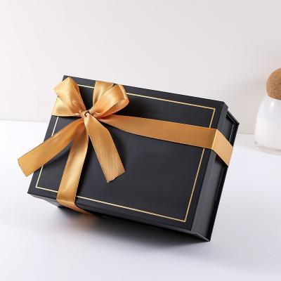 China Custom Luxury Satin Bow Gift Boxes - Foldable White Cardboard Packaging with Gold Foil & Custom Sizes for sale