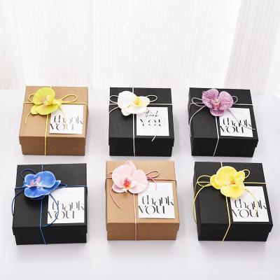 China Black Paper Packaging Box 28x20x9cm Custom Cosmetic Gift Box with Foil Stamping and UV Coating Options for sale