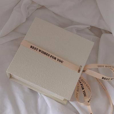 China Custom Ribbon Tied Gift Boxes with Satin Bow Closure - White Cardboard Material for Jewelry & Cosmetics Packaging for sale