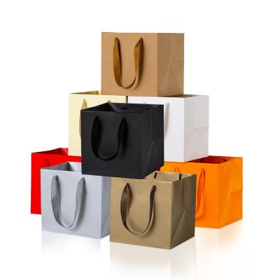 China Custom Flower Handbag Paper Tote Bags 10×6×10cm & 21×14×19cm Sizes with Custom Logo Printing for Gift Packaging for sale