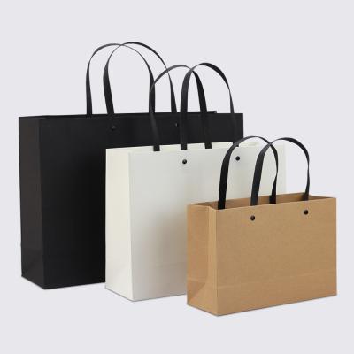 China Custom Pattern Kraft Tote Bags 17x25x9cm & 30x42x12cm Cardboard Paper Bags with Custom Logo Printing for sale