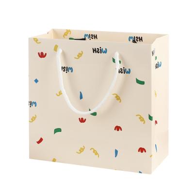 China Custom Heart Pattern Kraft Paper Gift Bags 24-Hour Quote with Foil Stamping & UV Coating Options for sale