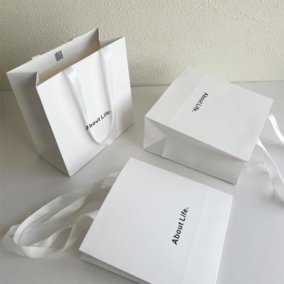 China White Cardboard Shopping Tote Bag 24x10x17cm with Custom Logo Printing for Clothing Stores and Gift Packaging for sale