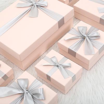 China Custom Cardboard Gift Box 14cm x 10cm x 7cm with Top & Bottom Cover and Pink Bow Decoration for sale