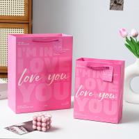 China Premium Textured Cardboard Gift Bags with Twisted Rope Handles - Custom Sizes & Colors Available for Romantic Packaging for sale