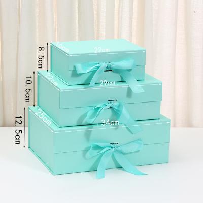 China Custom Rigid Magnetic Flip Gift Box 30x20x10cm White Cardboard With Ribbon For Wig Packaging & Luxury Gifts for sale