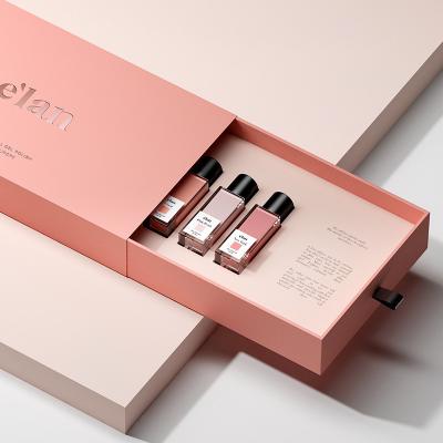 China Customizable Pink Drawer Style Gift Box for Cosmetics Packaging 3 Bottle Capacity for sale