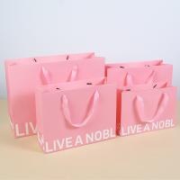China Custom Thickened Kraft Paper Gift Bags 28x20x10cm Clothing Store Tote Bags with Logo for sale
