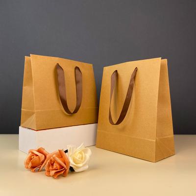 China Custom Kraft Paper Gift Bags with Handle 15x6x21cm Eco-Friendly Tote Bags for Branding for sale
