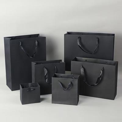 China Custom Kraft Paper Shopping Bags Wholesale 16x8x17cm Gift Tote Bags with Offset Printing for sale