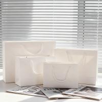 China Custom White Cardboard Tote Bags 13x19x6cm Gift Bags for Clothing Stores for sale