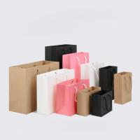China Custom Logo Paper Gift Bags with Twisted Rope Handles for Shopping Clothing Packaging 250gsm for sale