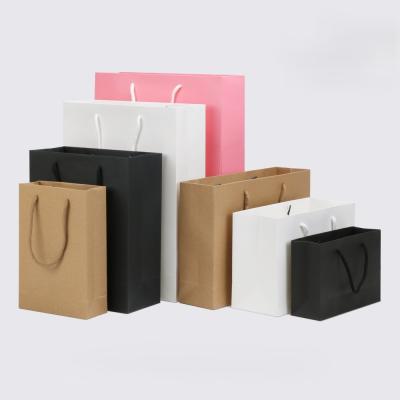China Custom Logo Paper Gift Bags with Twisted Rope Handles for Shopping Clothing Packaging 250gsm for sale
