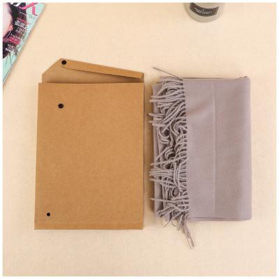 China Custom Kraft Paper Bags with Logo 26x26x3cm for T-Shirt Packaging and Document Storage for sale