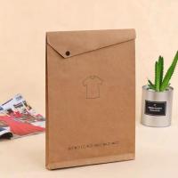 China Custom Kraft Paper Bags with Logo 26x26x3cm for T-Shirt Packaging and Document Storage for sale