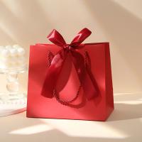 China Luxury Solid Color Kraft Paper Gift Bags with Ribbon Handles Custom Size Bulk for Retail Packaging for sale