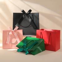 China Luxury Solid Color Kraft Paper Gift Bags with Ribbon Handles Custom Size Bulk for Retail Packaging for sale