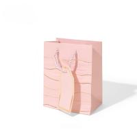 China Custom Embossed Paper Gift Bags with Rope Handles Pastel Gold Wave Design for Weddings Birthdays Shopping for sale