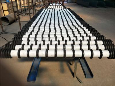 China Carbon Steel 63.5mm Spiral Return Roller with Deep Groove Ball Bearing for Belt Conveyor for sale