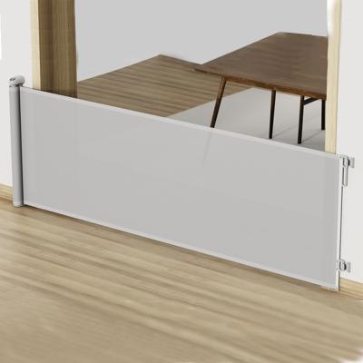 China Sturdy Retractable Children Gate Autolock Retractable Safety Gate for sale