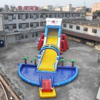 China 0.55mm PVC Rainbow Themed Long Inflatable Water Slip And Slide With Swimming Pool for sale