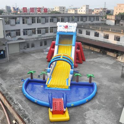 China 0.55mm PVC Rainbow Themed Long Inflatable Water Slip And Slide With Swimming Pool for sale