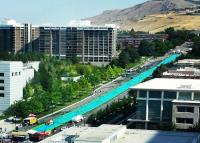 China Funny Green 300m Long Giant Inflatable Water Slide Durable Pvc Commercial for sale