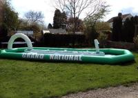 China Grand National Children / Adult Inflatable Interactive Games With Enclosed Race Track for sale