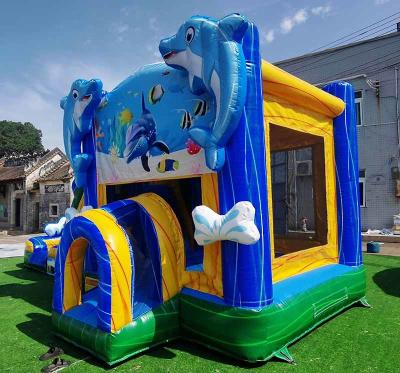 China Custom Made Dolphin Bounce House With Slide Underwater World Theme Jumping Castle For Kids for sale