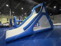 China Commercial Inflatable Floating Water Slide Toys With Climbing Wall For Water Park for sale