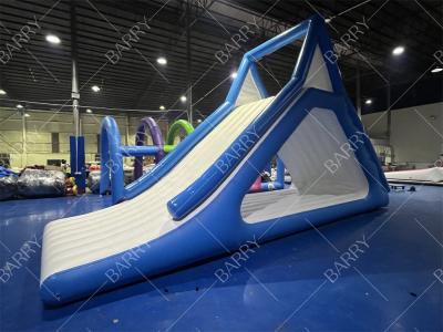 China Commercial Inflatable Floating Water Slide Toys With Climbing Wall For Water Park for sale