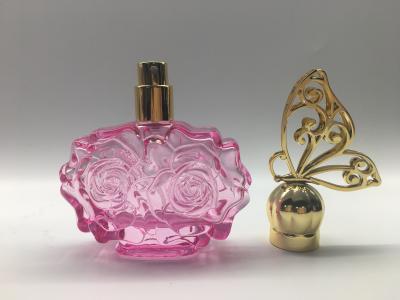 China 30ml 50ml Glass Perfume Bottle Rose Shape Pink Color With Butterfly Cap for sale
