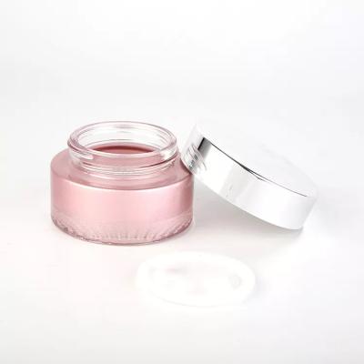 China Pink Color Painting Glass Cosmetic Jar 50g Silver Screw Up Cap For Skin Care Cream for sale
