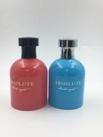 China Round Shoulder Luxury Glass Perfume Bottle 100ml Blue Red Customized for sale