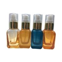 China SGS ISO MSDS Orange Blue 20ml Glass Pump Bottle For Lotion And Serum for sale