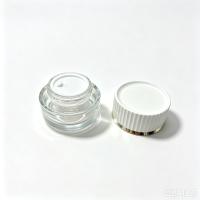 China Luxury Glass Jar 30g and 50g with Vertical Ribbed White Cap Gold Decorative Ring for Face Cream Skincare Container for sale