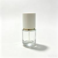 China Empty Clear Glass Pump Bottle 30ml and 50ml Cosmetic Serum Lotion Container Ribbed White Cap Gold Press Pump Skincare Packaging for sale