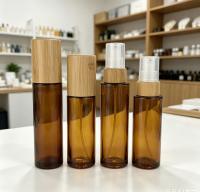 China 30ml 50ml customed Color Glass Bottle Press Pump Type Bamboo Lid  for Cosmetics for sale