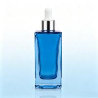 China Blue Transparent Glass Dropper Bottle, Thick Base Square Cosmetic Serum Oil Packaging Bottle with White Rubber Dropper for sale