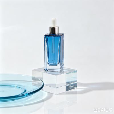 China Blue Transparent Glass Dropper Bottle, Thick Base Square Cosmetic Serum Oil Packaging Bottle with White Rubber Dropper for sale