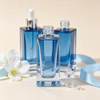 China Blue Transparent Glass Dropper Bottle, Thick Base Square Cosmetic Serum Oil Packaging Bottle with White Rubber Dropper for sale
