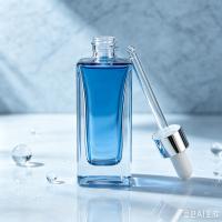China Blue Transparent Glass Dropper Bottle, Thick Base Square Cosmetic Serum Oil Packaging Bottle with White Rubber Dropper for sale