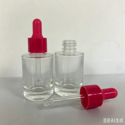 China 30ml ClearThick Base Glass Dropper Bottle with Red Rubber Bulb, Cosmetic Serum Essential Oil Glass Bottle for Skincare Packaging for sale