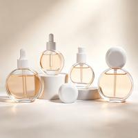 China Luxury Flat Round Glass Bottle 30ml 60ml Dropper/pump Lotion Bottle Cosmetic Packaging Wholesale From Source Factory for sale