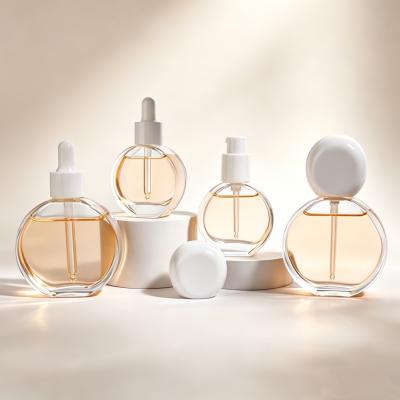 China Luxury Flat Round Glass Bottle 30ml 60ml Dropper/pump Lotion Bottle Cosmetic Packaging Wholesale From Source Factory for sale