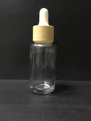 China Transparent 30ml Essential Oil Bottles Glass Dropper Bottle With Plastic Cap Skincare Packaging for sale